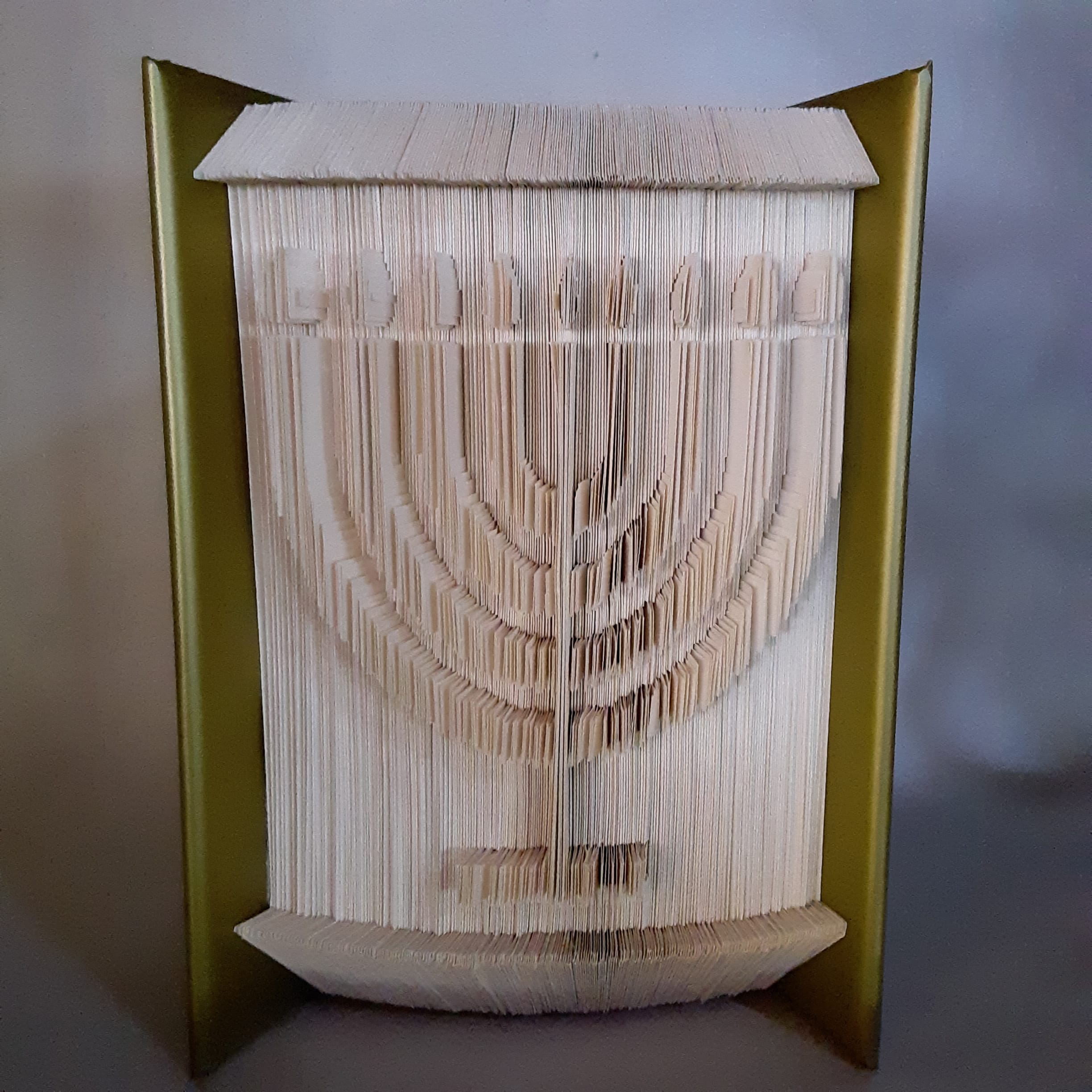 When he’s not repairing books, local retiree turns them into works of ...