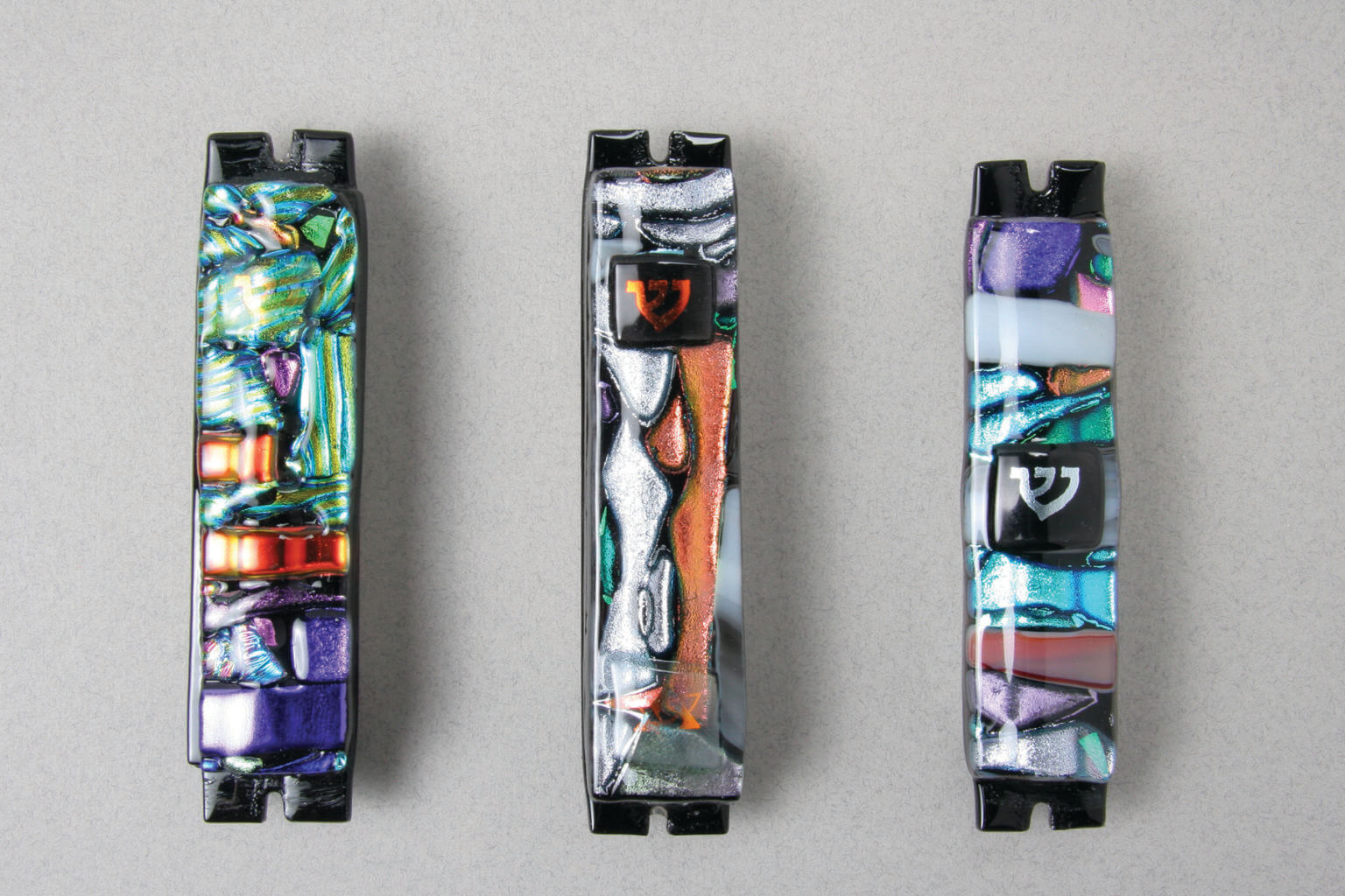 Artfully or plainly encased, mezuzot provide a mitzvah at your door ...